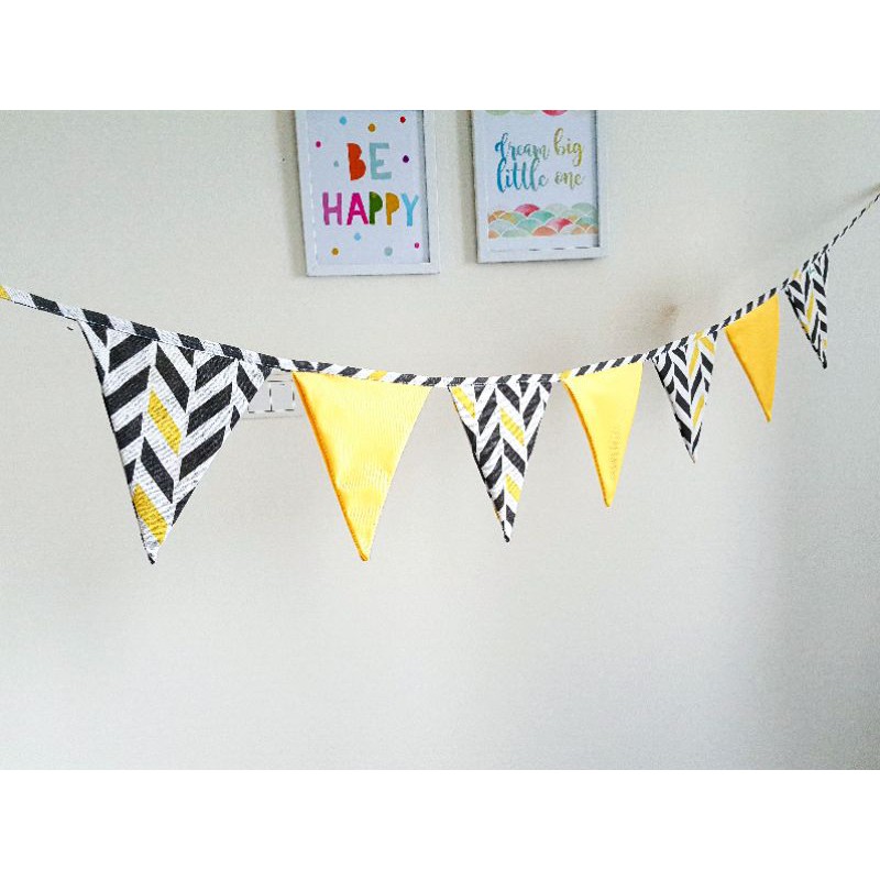 Triangular flag string made of yellow cotton canvas with decorative ...