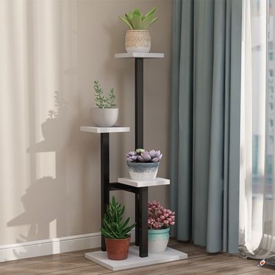 Wrought iron flower stand next to TV cabinet in the living room, floor ...