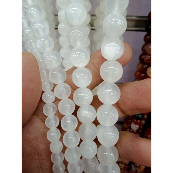 white calcite stone/selenite Pink angelite, tiger eye, yellow jade ...