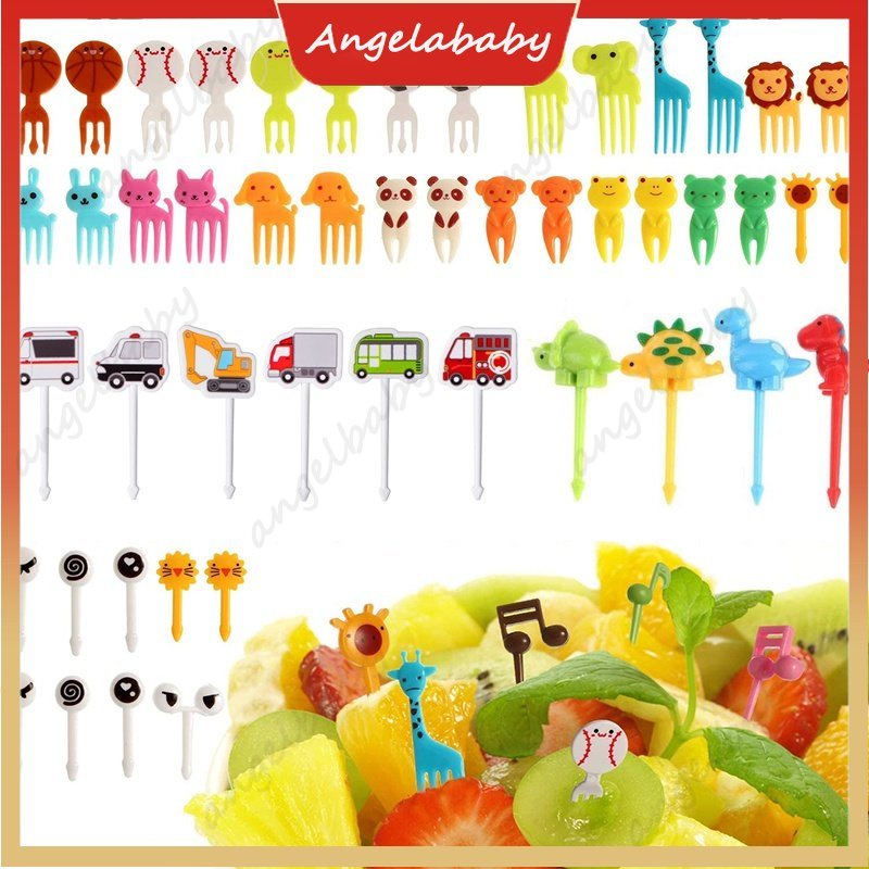 Children's food selection with assorted bento sticks and fruit forks ...