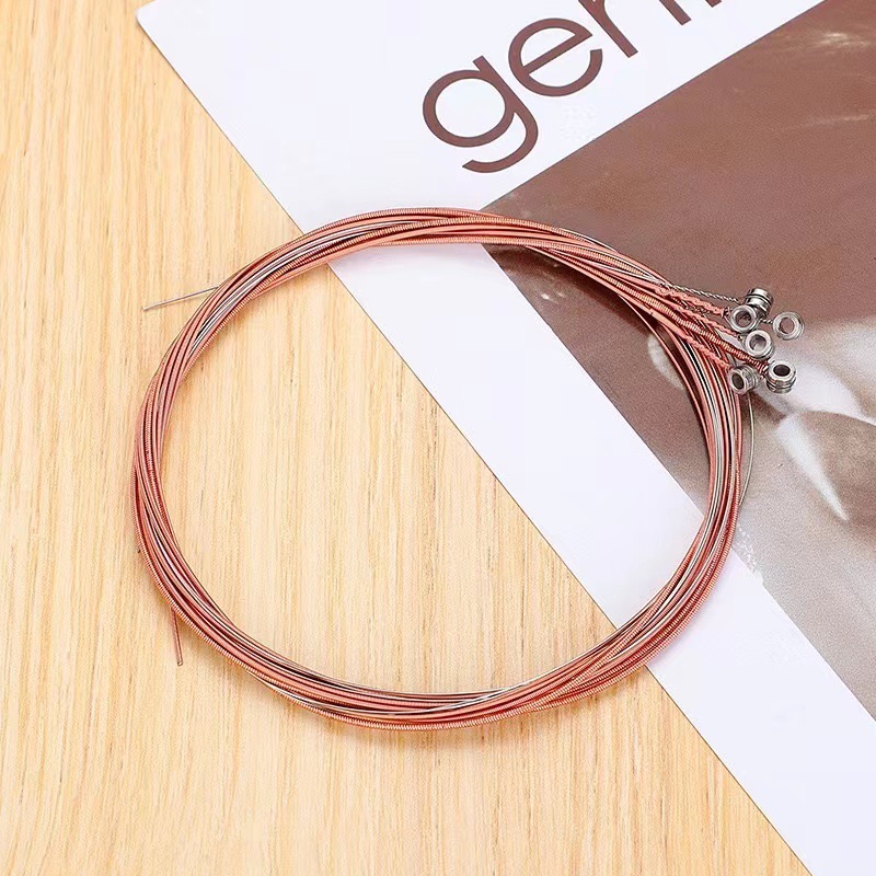 Guitar strings folk music wooden guitar brass red copper color strings ...