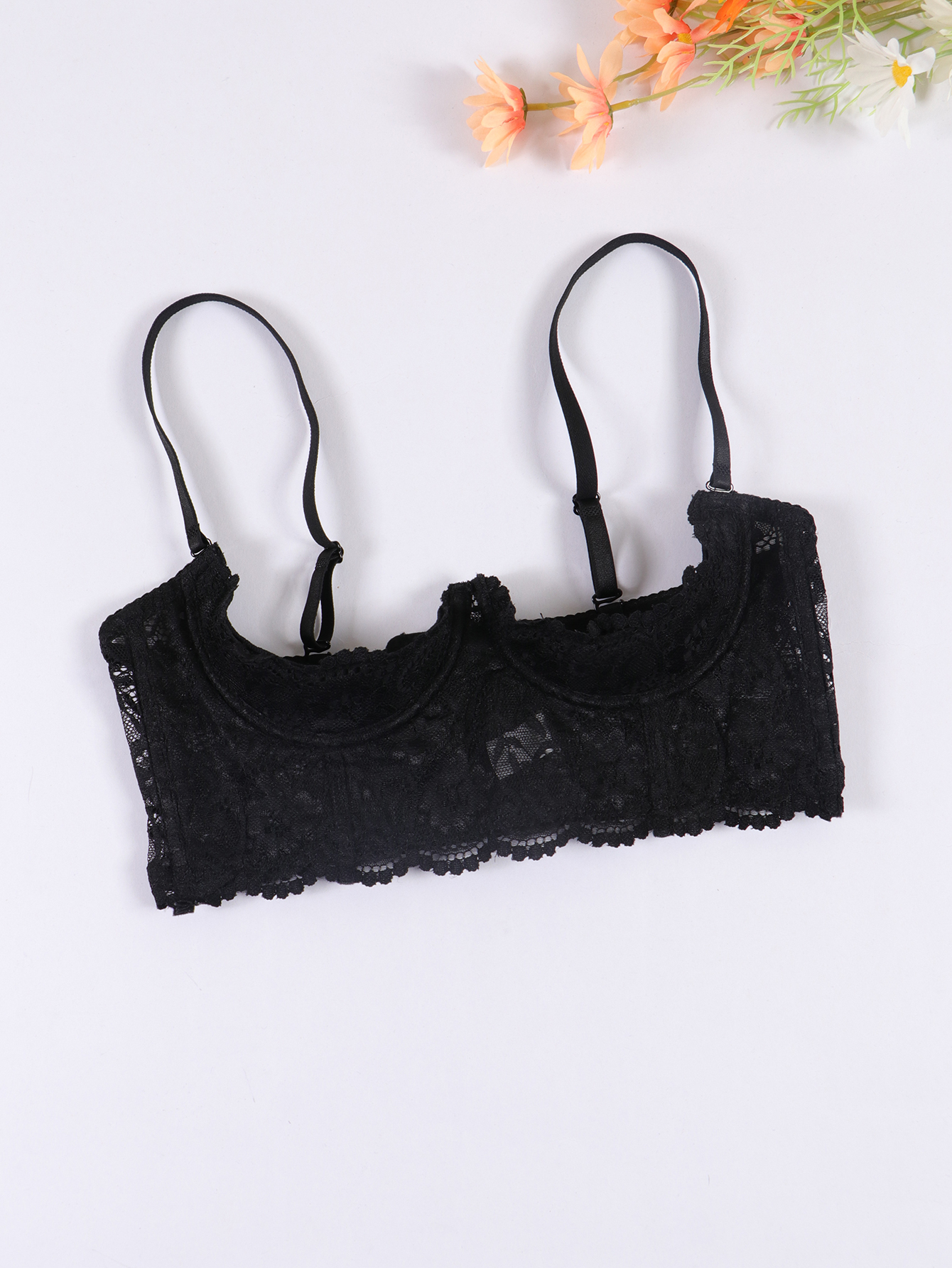 A quarter cup bra set with lace that lifts and gathers, designed to ...