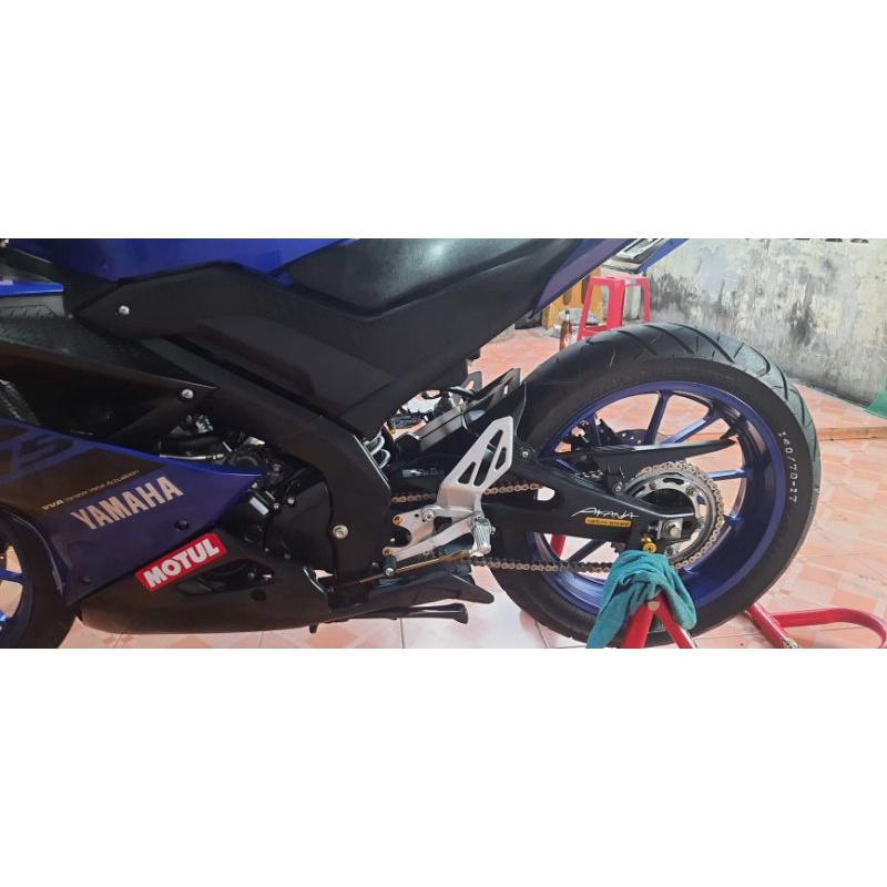 A set of foot pegs like wearing the New-R15 rear gear, consisting of a ...