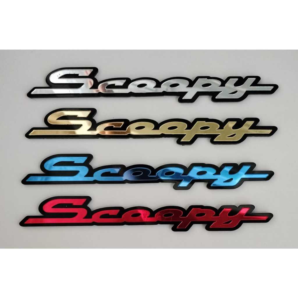 The 3d hoda scoopy emblem is connected to a pair of acrylic emblems ...