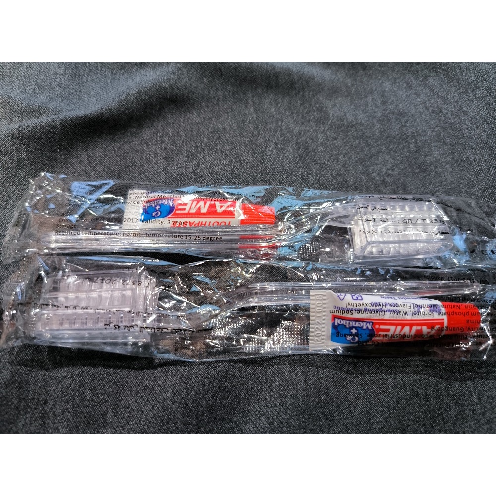 Dental kit toothbrush with cap and 3g toothpaste pair wrapped in clear ...