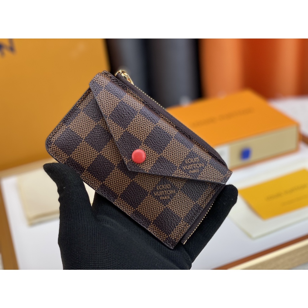 LV Recto Verso clip features a classic Monogram canvas with sharp ...