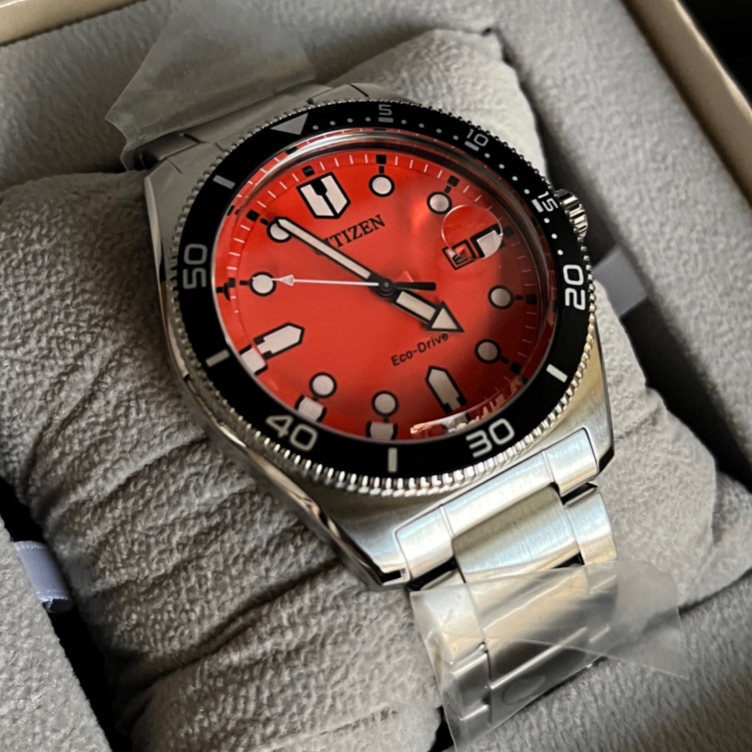 Citizen Watch Eco-Drive AW1760-81X Orange Date Dial Silver Steel Strap ...