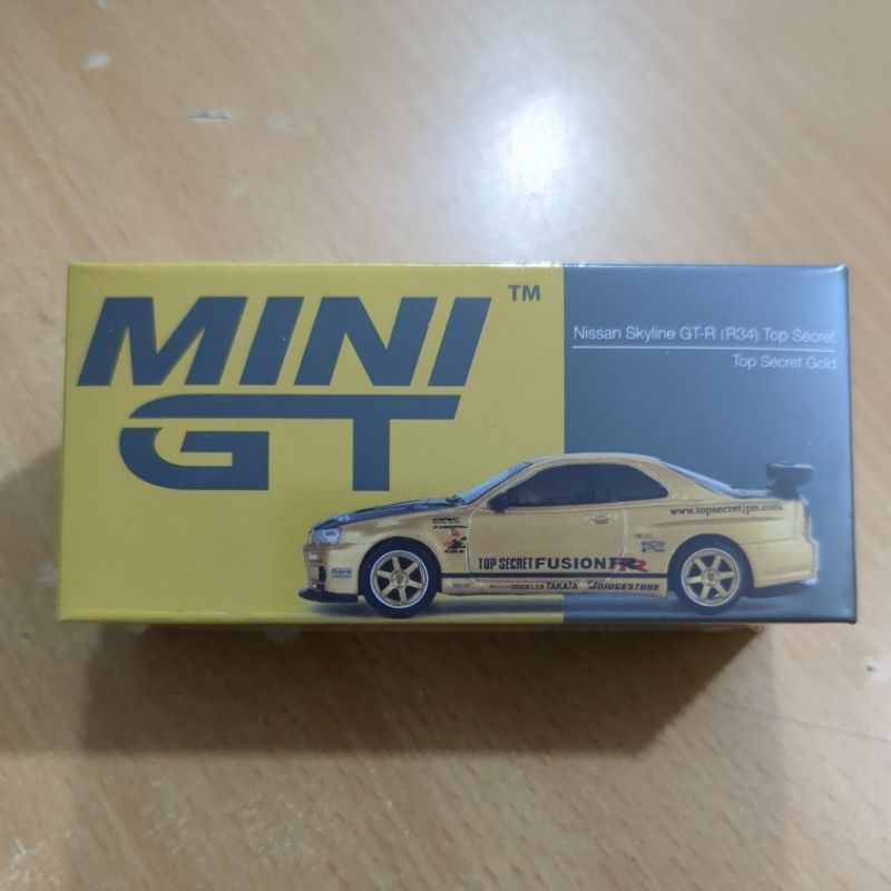 Mini GT Nissan Skyline GT-R (R34) Top Secret (Gold) Sealed | Shopee ...