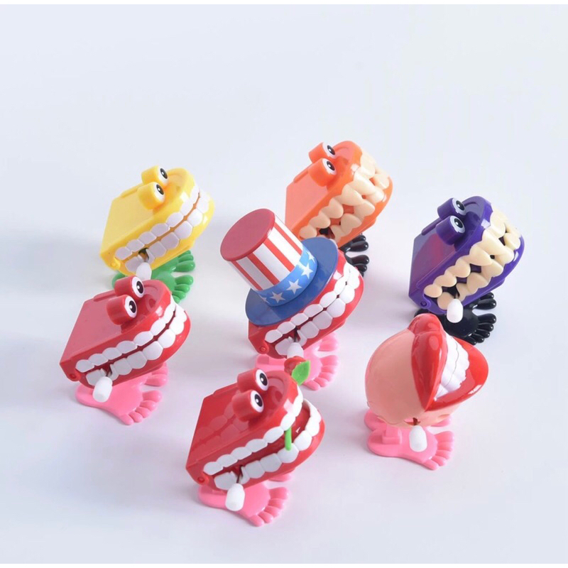 Jumping Teeth Chattering Smile Teeth Small Wind Up Feet Toy | Shopee ...