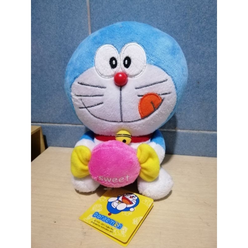 Doraemon holding sweet plush FUJIKO PRO | Shopee Philippines