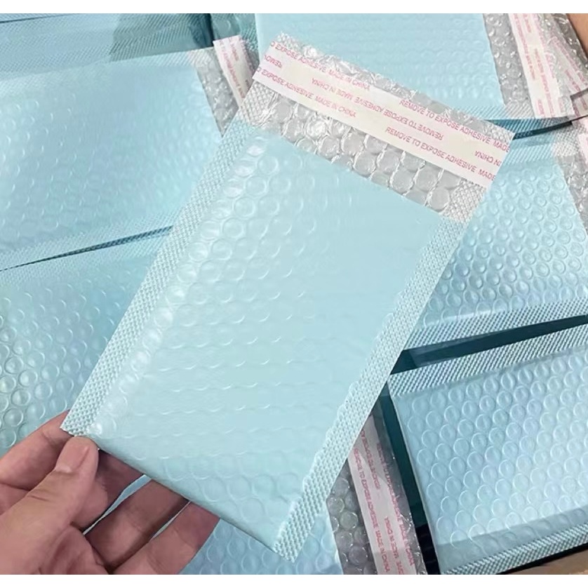 1 blue kraft paper bubble envelope. Packaging material and plastic ...