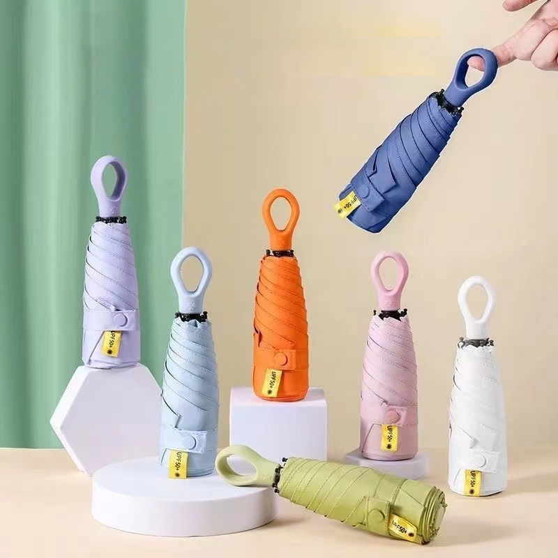 Wholesale Capsule Umbrella UPF50+ with Handle Portable Mini Umbrella UV ...