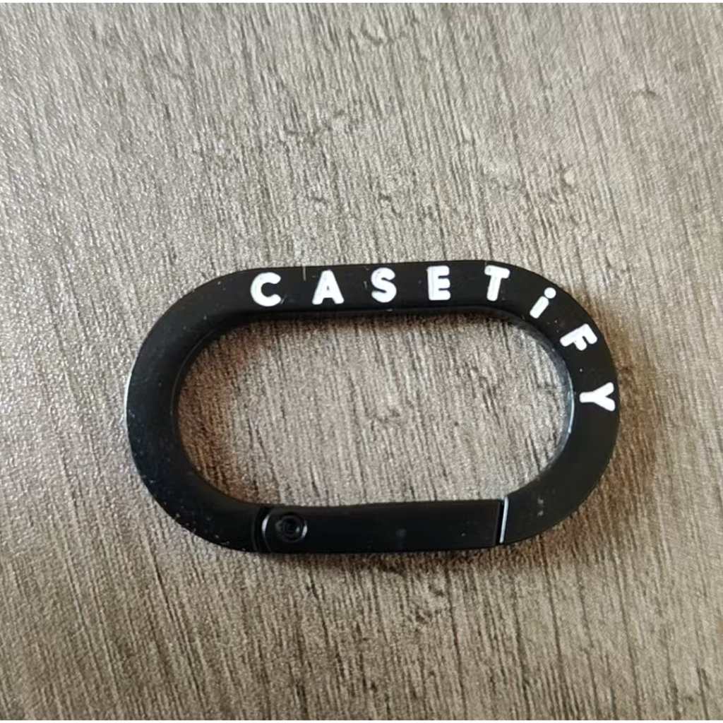 CASETiFY earphone case hanging buckle mountain buckle black keychain ...