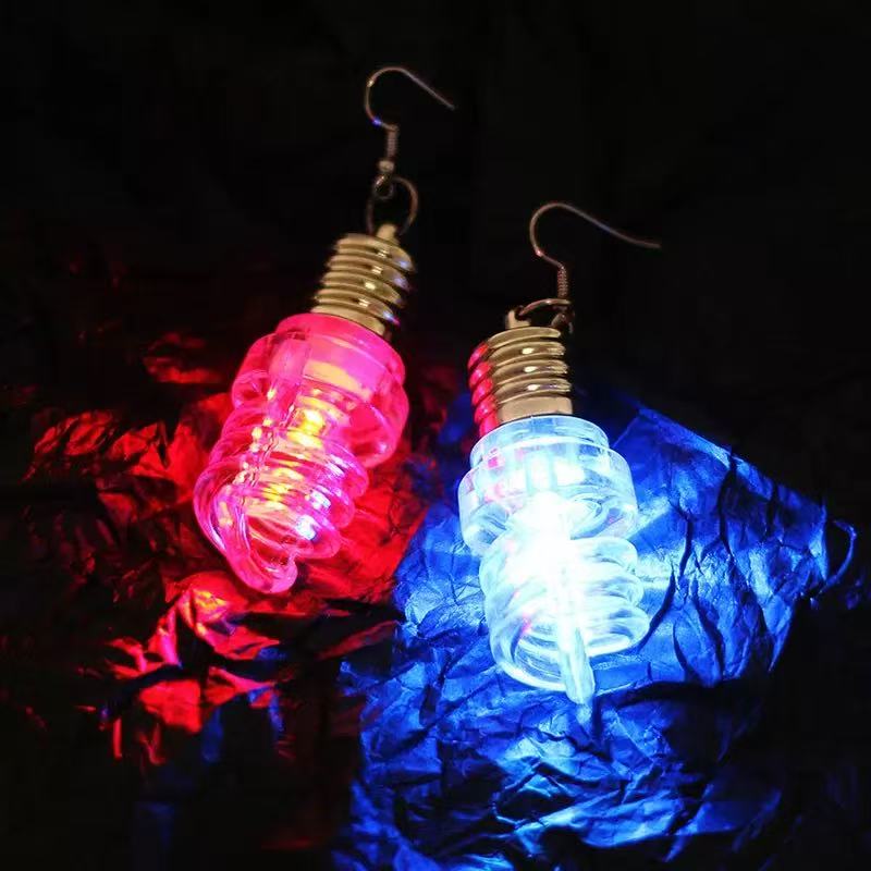 Colorful light bulb earrings worn by fashionable women with flashing ...