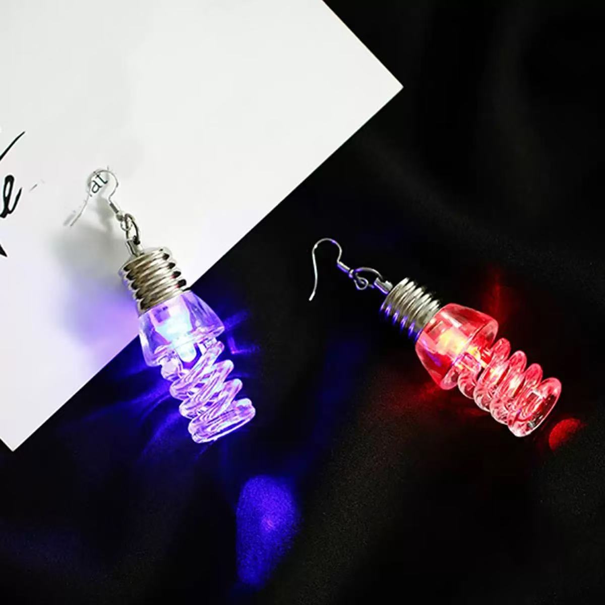 Colorful light bulb earrings worn by fashionable women with flashing ...