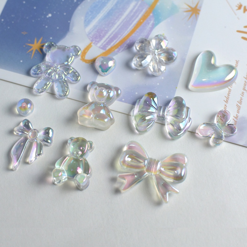 Jibbitz stickers attached to Crocs sandals with round beads, hearts ...