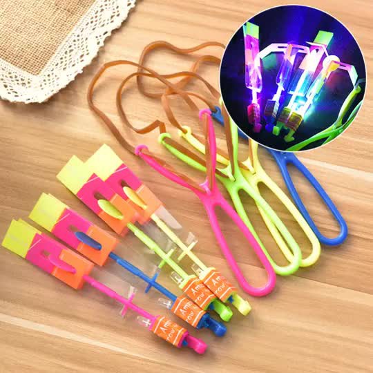 Pinwheel Toys Flying Rotating Helicopter Meteor Shower Lights Rocket ...