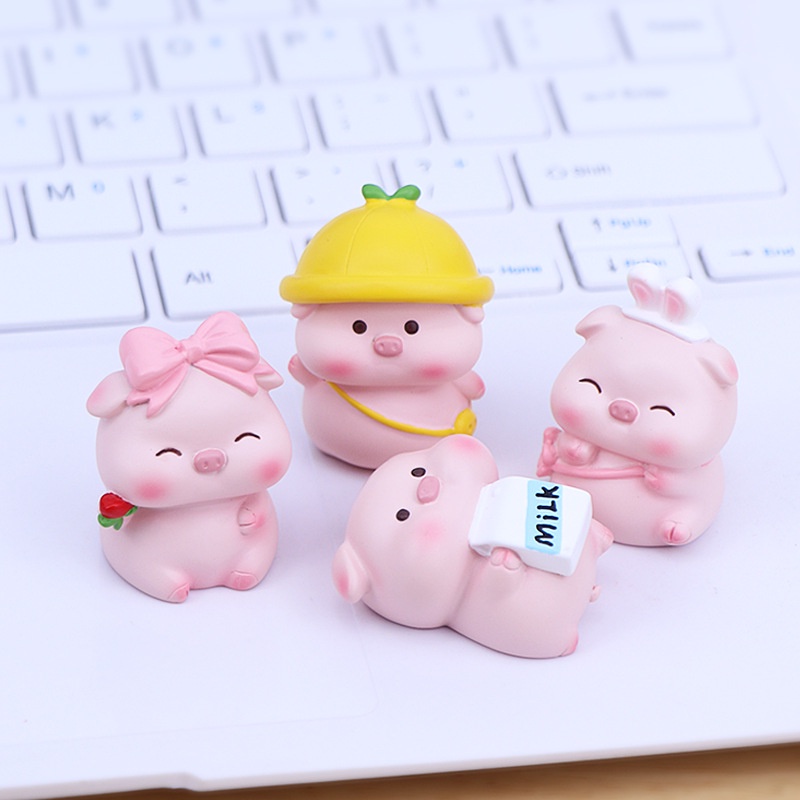 Cute mini pig model made from artificial stone, displaying desks, study ...