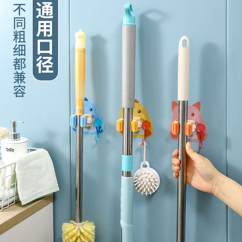 【Spots】新款拖把夹免打孔无痕扫把粘钩强力挂架卫生间浴室壁挂可爱收纳架New mop clip with no punching and ...
