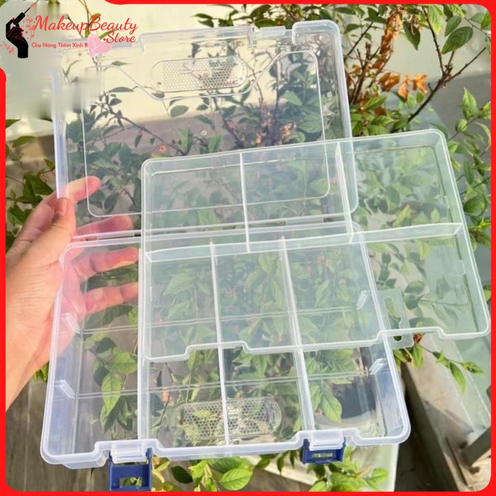 2-layer plastic box divided into compartments for storing staples and ...