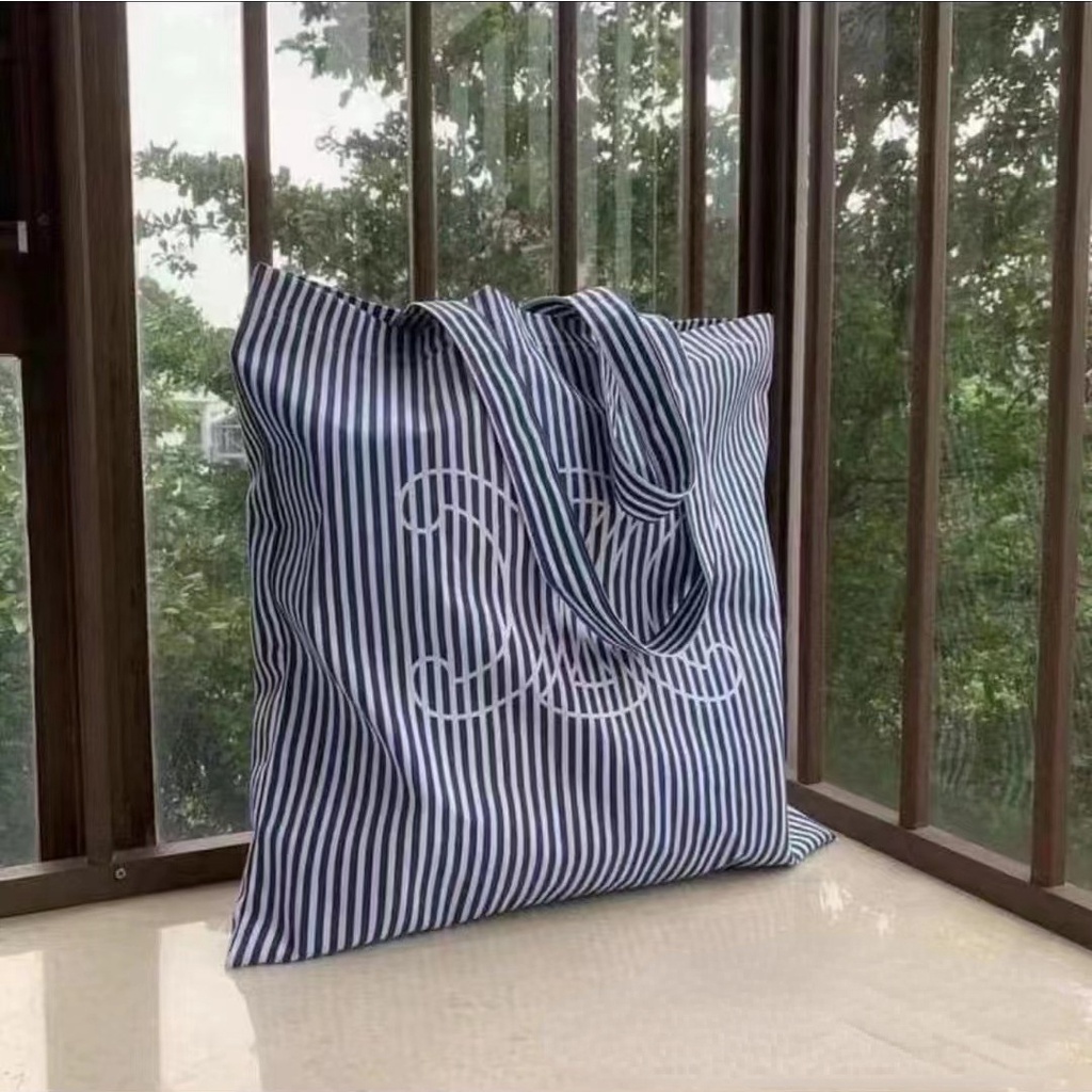 2023 New Toth canvas bag hand bill shoulder blue and white striped ...