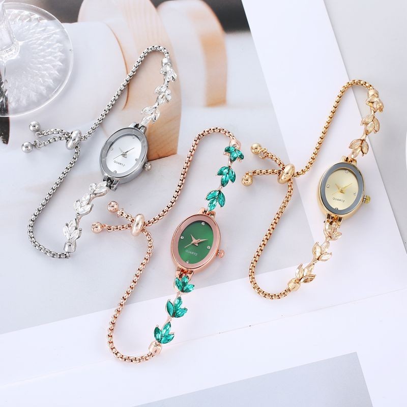 Girls watches are decorated with small leaves and studded with diamonds ...