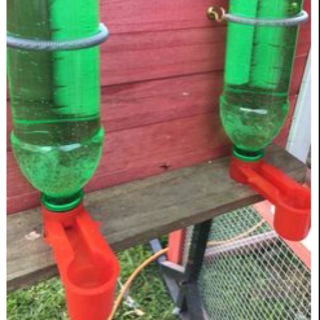 2 automatic drinking troughs attached to plastic bottles, drinking ...
