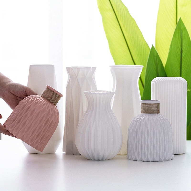 Modern plastic vases imitating ceramic flower pots, flower baskets ...