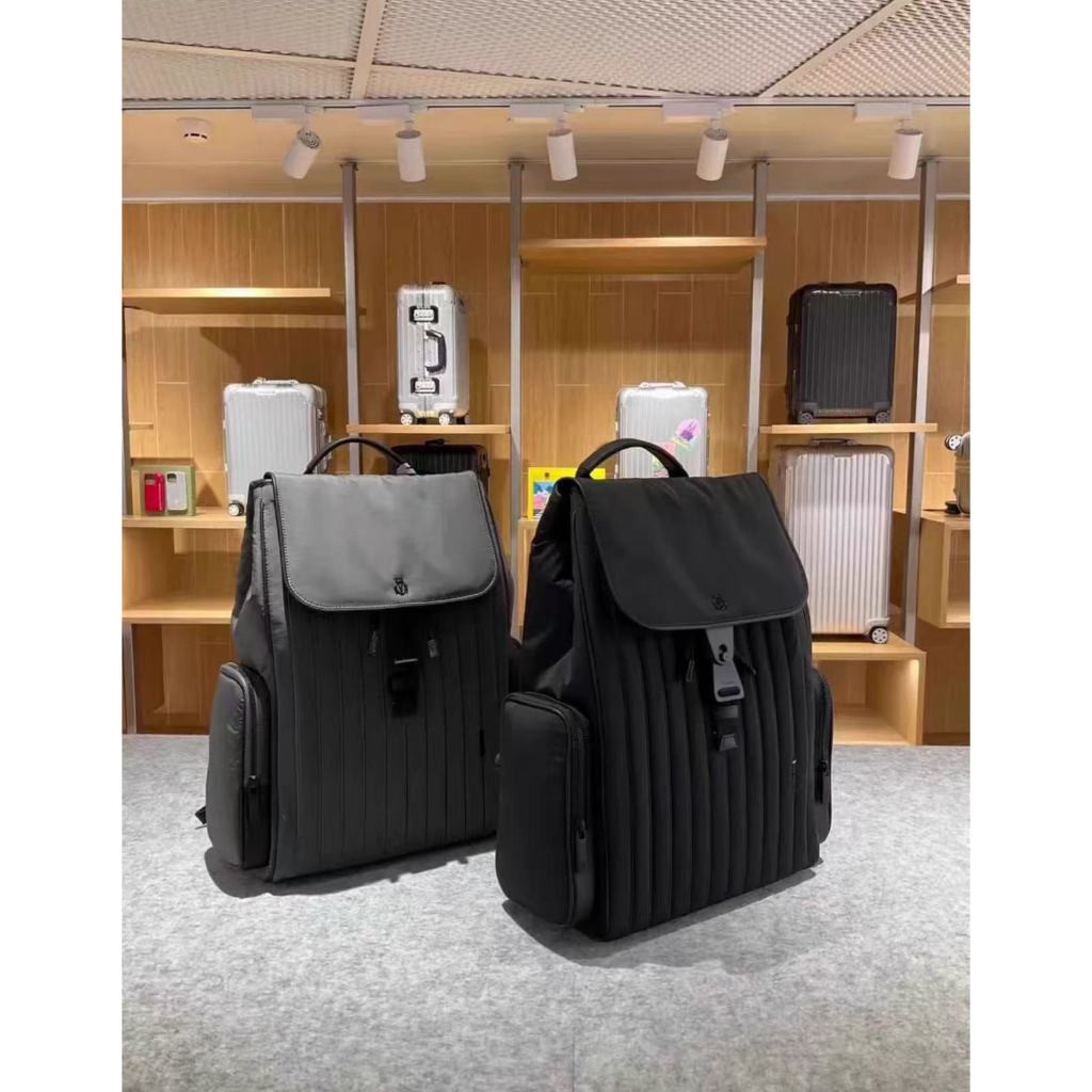 Travel backpack made of nylon material, available in two colors: black ...