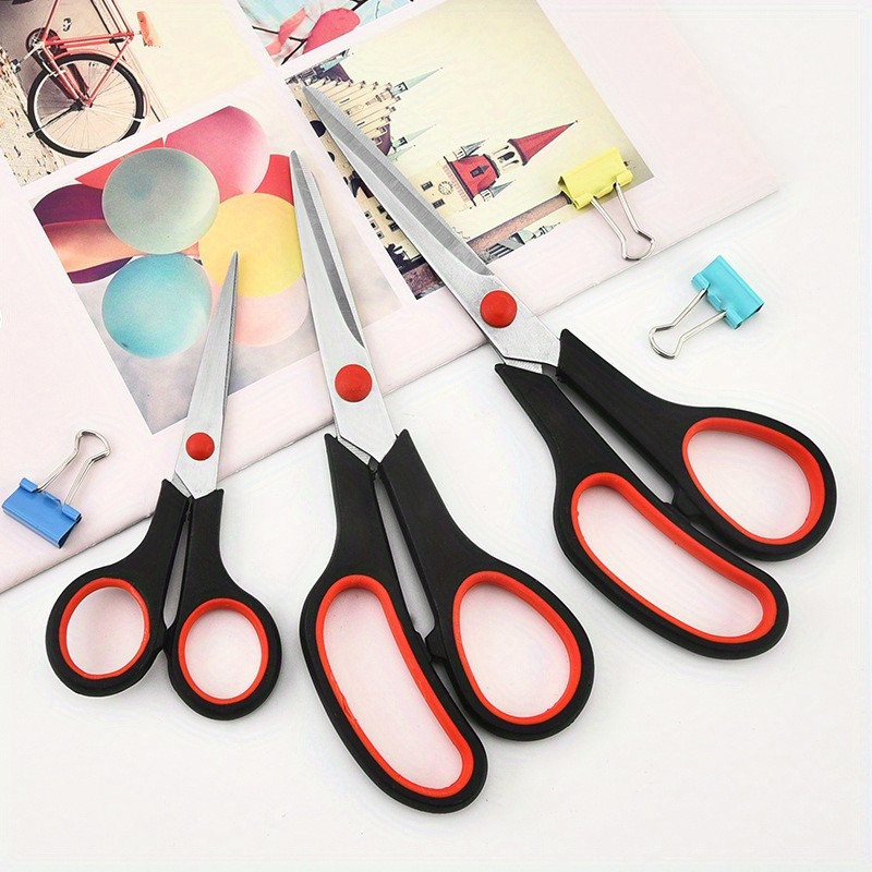 A set of three stainless steel scissors, office stationery scissors ...