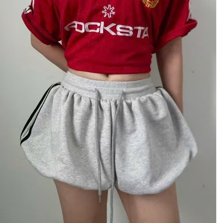 Puffed form shorts with stripes on both sides made of thick fishskin ...
