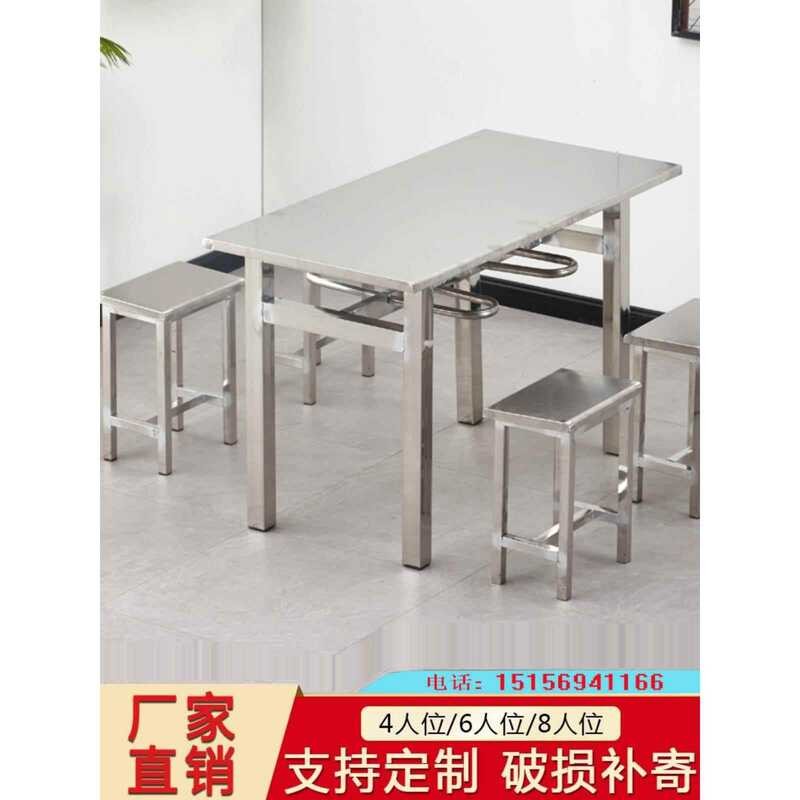 School staff, stainless steel cafeteria dining tables, chairs, hanging ...