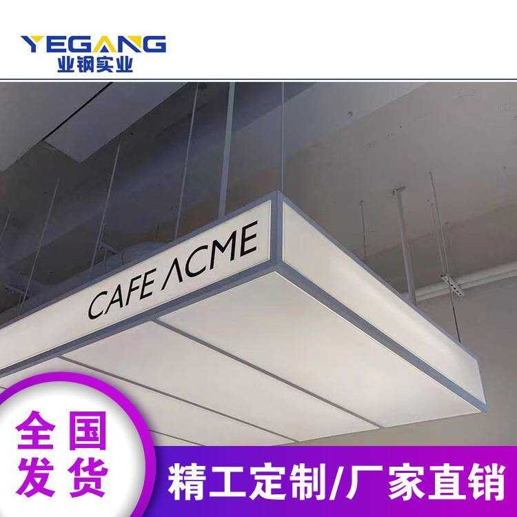 A new type of suspended ceiling sign is hung above the indoor bar ...