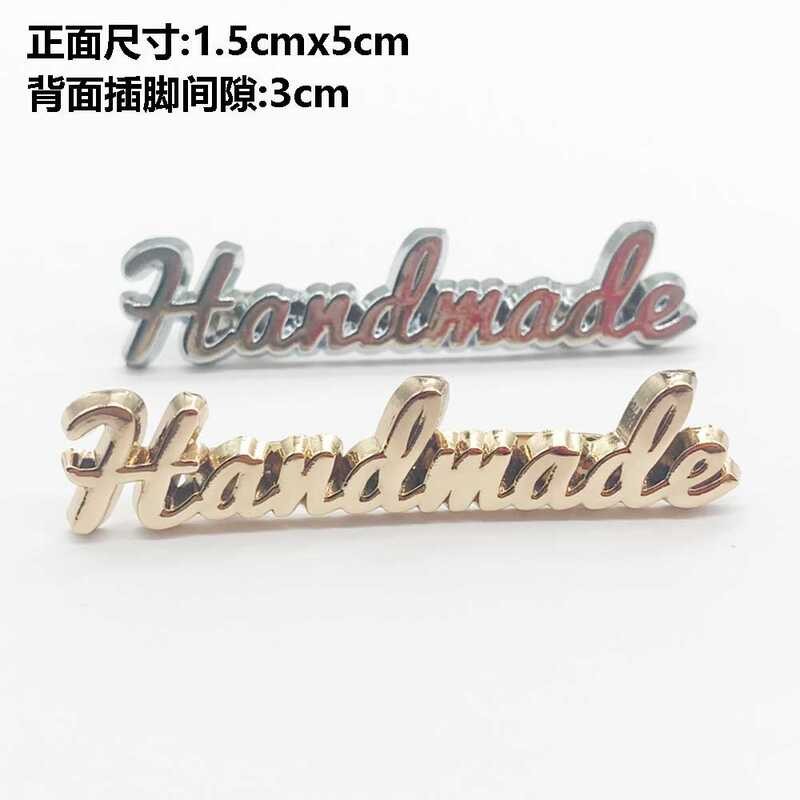 Hand fixed tags with pins, high-end metal tags, trade marks, handmade ...