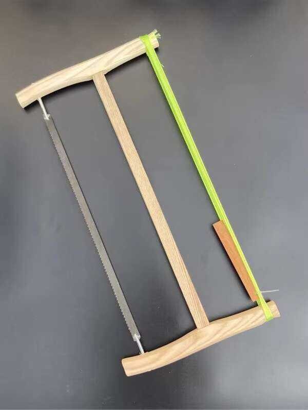 Saw, old fashioned traditional frame pulled curved winding hands ...