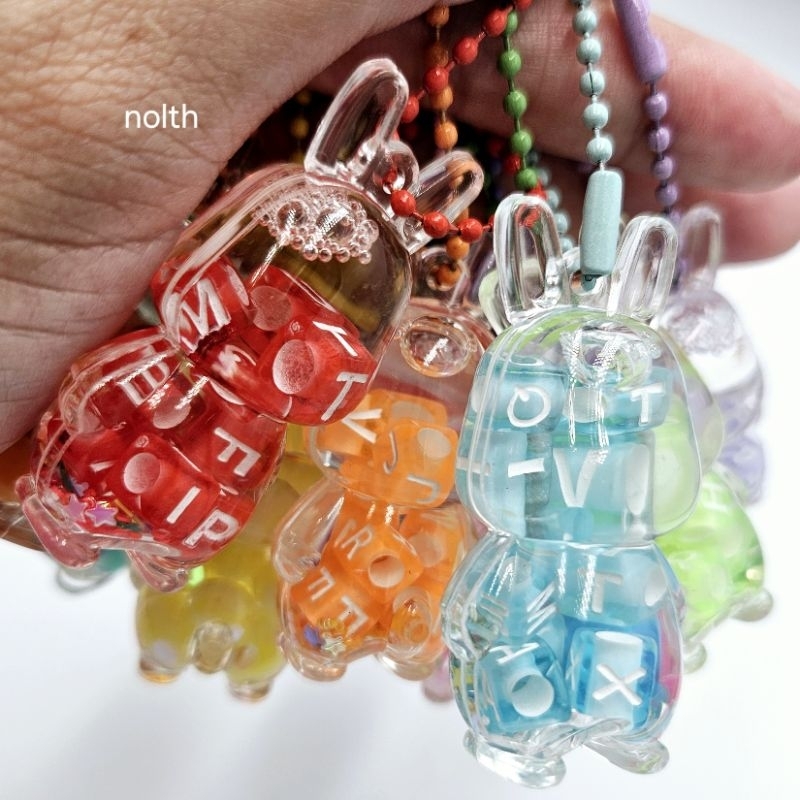 A Cute Transparent Rabbit Keychain With Variety Of Patterns. There Are ...