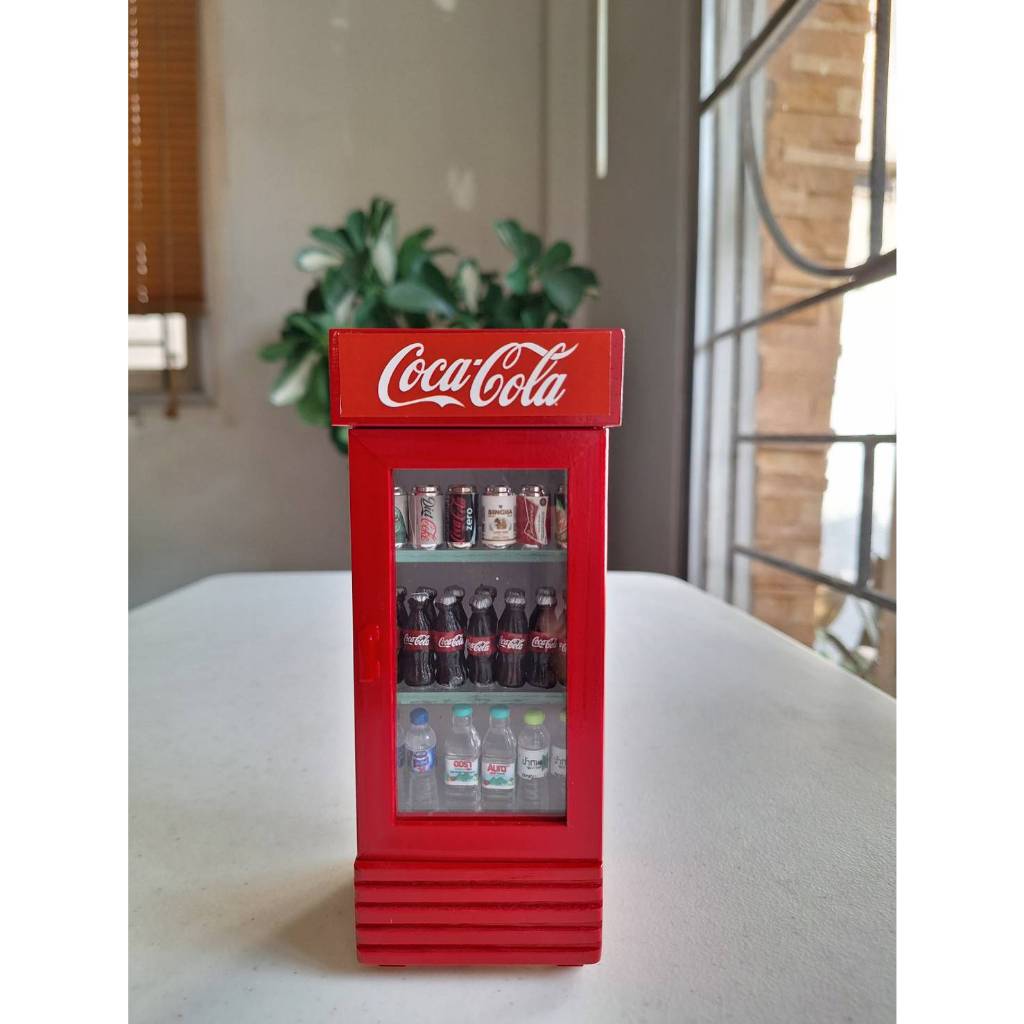 Model Of Miniature Red Coke Refrigerator Model. With Drink In The Water ...