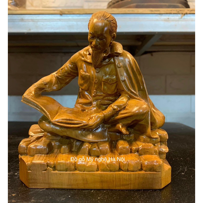 Statue of Uncle Ho sitting and reading a book in a cave bundle of fragrant cypress wood (height ...