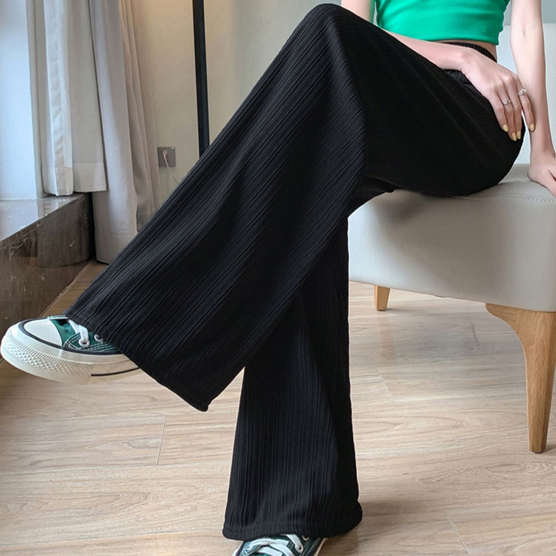 Women's high-waisted wide-leg trousers with elastic waistband and ...