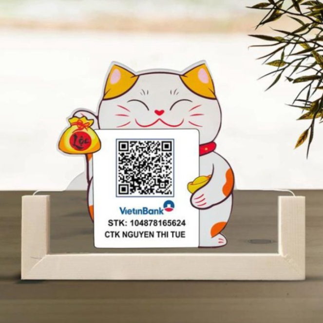 Mica board shaped like a lucky cat on the table with qr code printed on ...