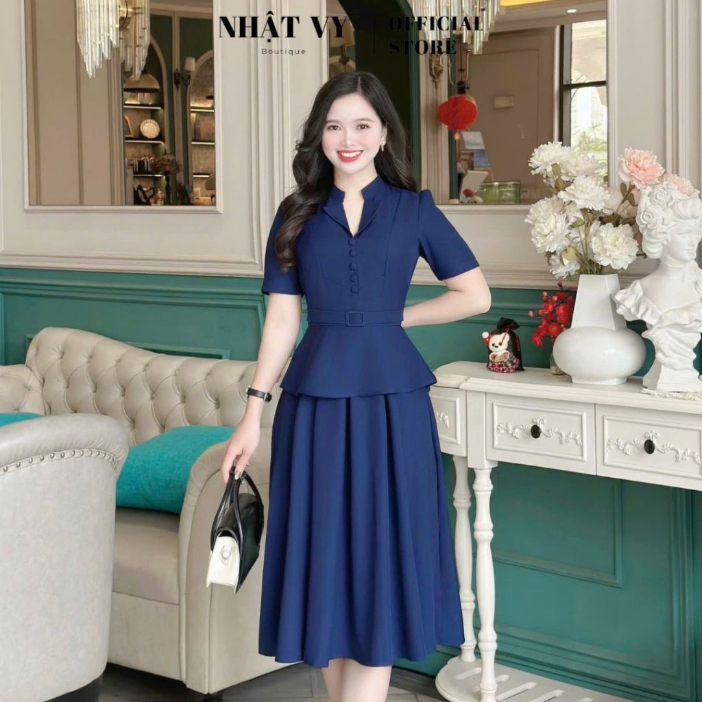 Nhat Vy office peplum dress with stylized train collar and buttons covered in silk, suitable for ...