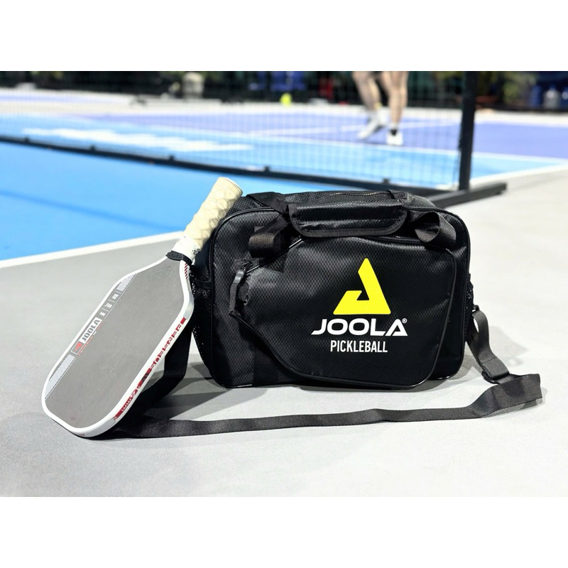 Clear sports bag containing JOOLA Pickleball rackets made in Korea ...