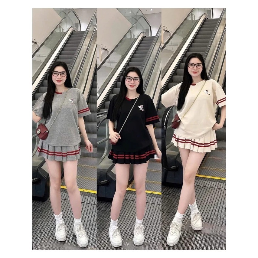 Set of Tieu Thu dresses embroidered with red striped dog logo and ...