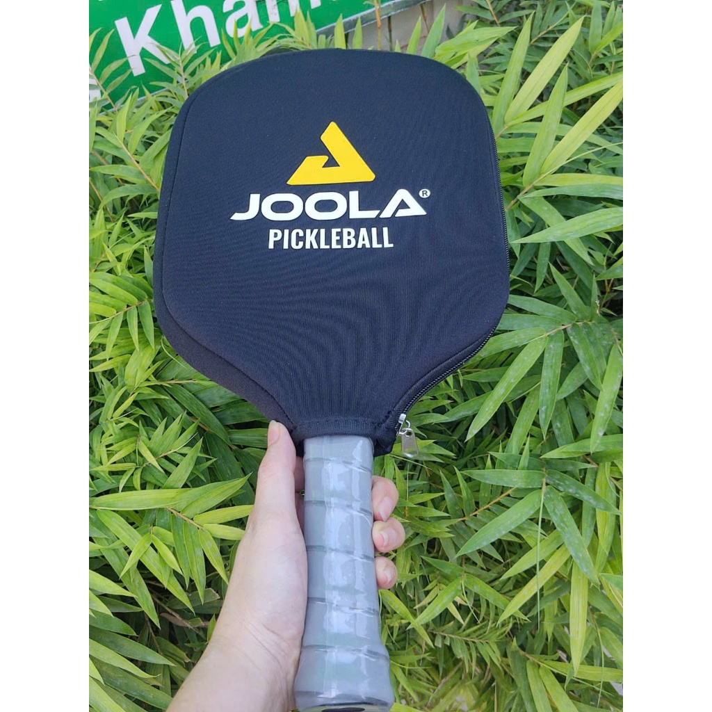 Pickleball racket cover with Jooola printed on it, protects the racket ...
