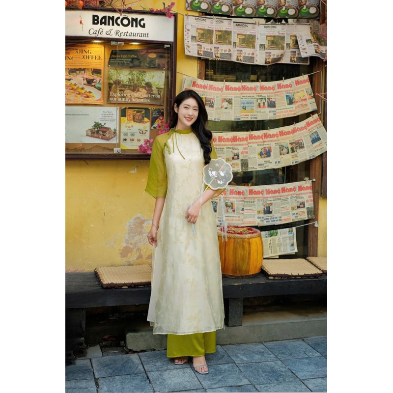 Innovative Truc Linh Ao Dai with a very pretty bow tie collar | Shopee ...