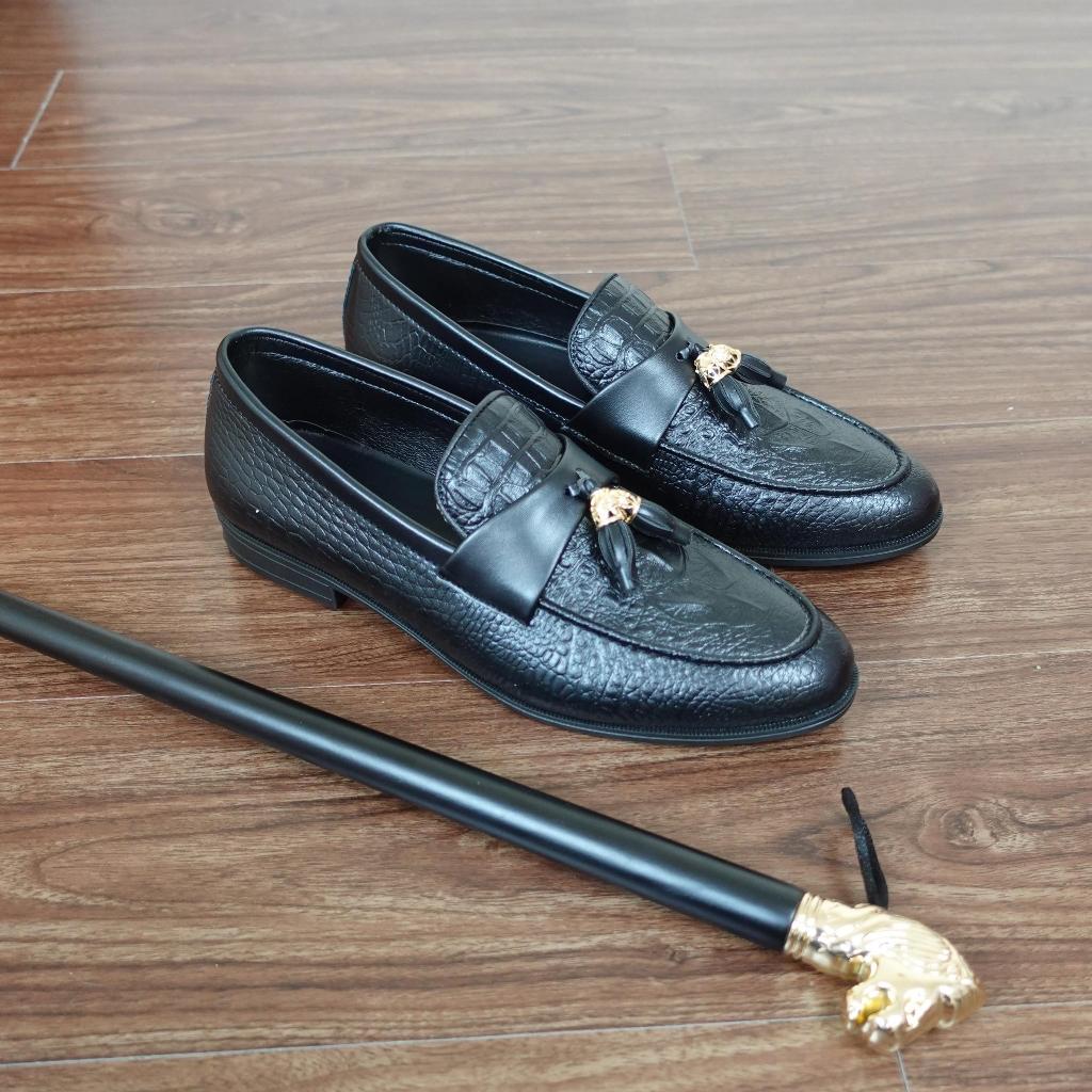 Fashionable embossed men's loafers decorated with bells in matte ...