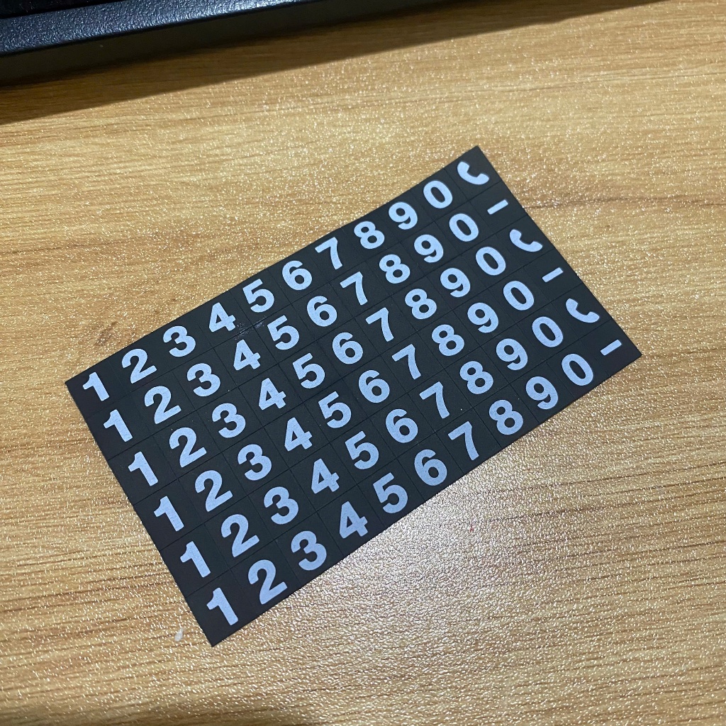 Odd set of numbers to replace black background and white letters in car ...