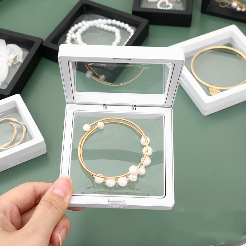Compact jewelry and accessory box covered with transparent PE plastic ...